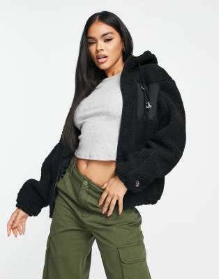 Champion – Svart anorak med liten logga | ASOS