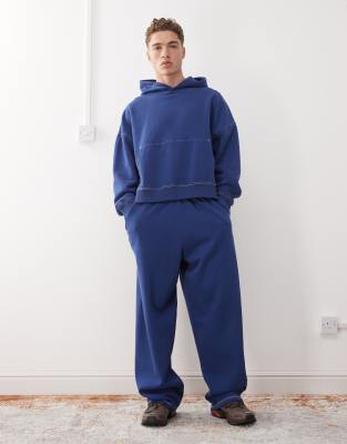 COLLUSION baggy relaxed trackies in washed navy | ASOS