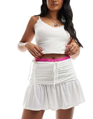 COLLUSION festival flippy mini skirt with ties and lace trim in cream ...