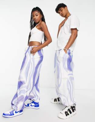 COLLUSION Unisex oversized cargo pants in blue warped print | ASOS