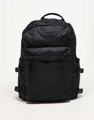 Consigned – Nylon-Rucksack in Schwarz mit seitlichem Clip | ASOS