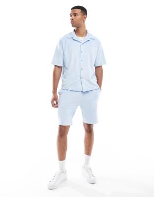 Criminal Damage varsity polo shirt & shorts in blue | ASOS
