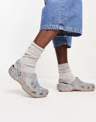 Crocs classic topographic clogs in beige blue | ASOS