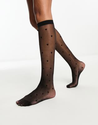 Daisy Street heart print socks in black | ASOS