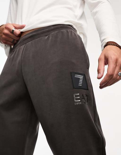EA7 soft touch logo trackies in dark brown | ASOS