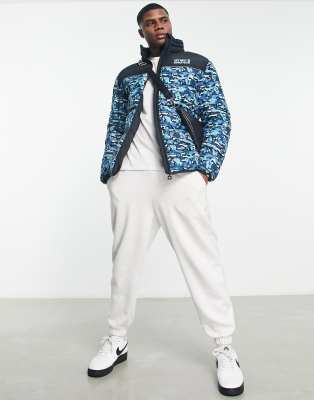 ellesse puffer jacket with print in blue | ASOS