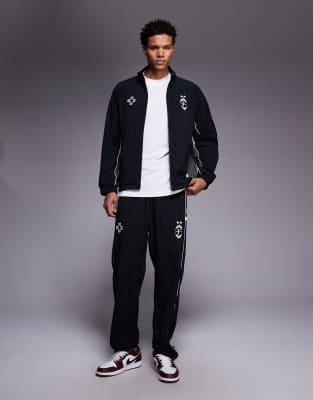 Faded Store nylon football jacket & trackies set in black | ASOS