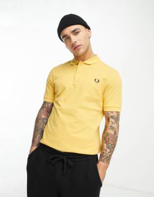Fred Perry plain polo shirt in yellow | The Hoxton Trend