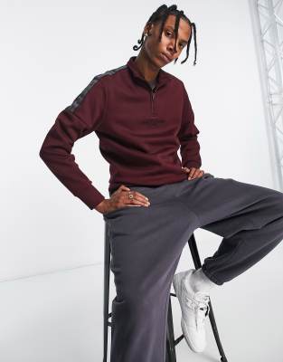 Fred Perry taped quarter zip sweat in red | ASOS