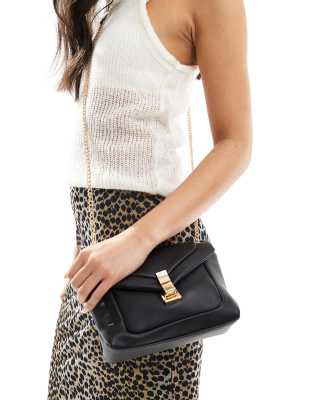 Glamorous padded crossbody bag with chain strap in black | ASOS