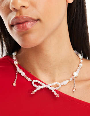 Heretic Nine Exclusive pearls beaded choker necklace with bow | ASOS