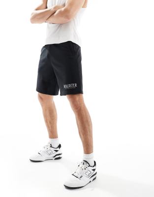 Hollister 9inch tech logo sweat shorts in black | ASOS