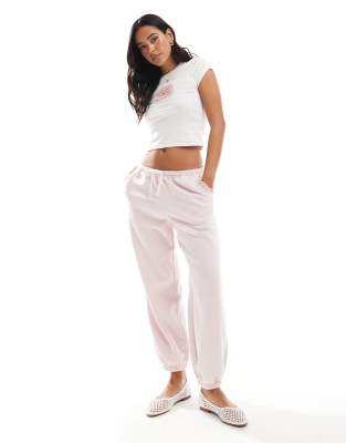 Hollister low rise cuffed trackies in light pink | ASOS