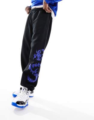 HUF dragon jersey trackies in black with placement prints (Part of a ...