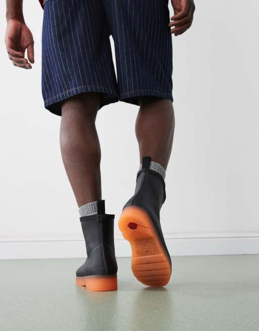 Hunter Play short boots with translucent sole in black | ASOS