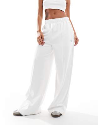 Lacoste wide leg trackies in white | ASOS