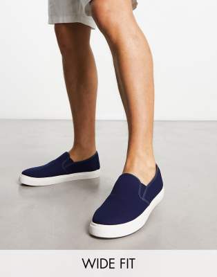 London Rebel X wide fit canvas slip on plimsolls in navy | ASOS