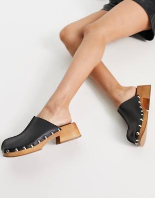 Mango – Clogs in Schwarz mit flacher Plateausohle | ASOS