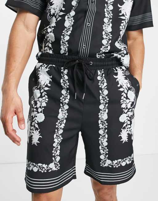 Mennace printed border shorts in black | ASOS