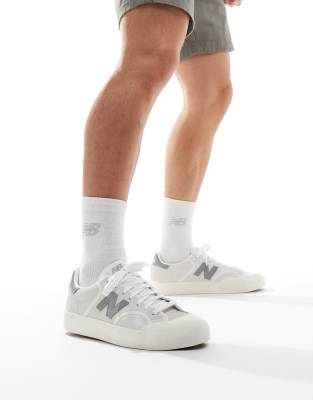 New Balance 100 trainers in white and grey | ASOS