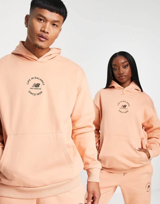 New Balance Life In Balance Felpa Con Cappuccio Unisex Corallo