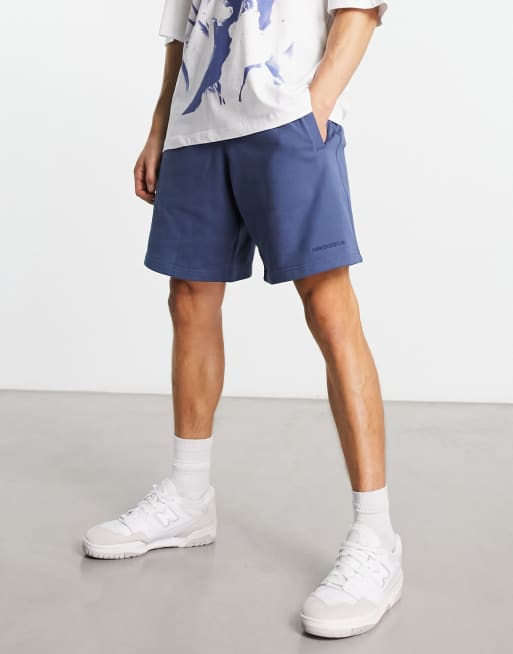 New Balance washed shorts with logo in washed blue | ASOS