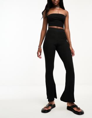 Night Addict ribbed flared leggings in black | ASOS