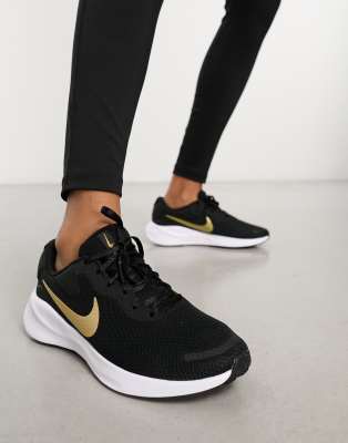 Nike Running Revolution 7 trainers in black and gold | ASOS