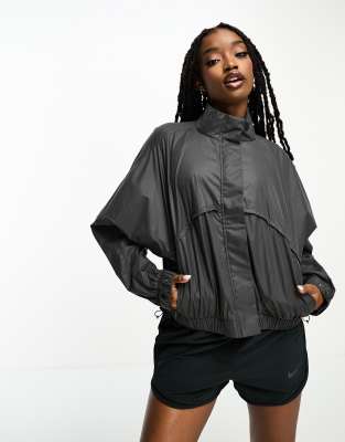 Nike Running Run Division reflective jacket in black | ASOS