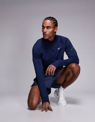 Nike Running Stride Dri-FIT half zip long sleeve top in navy | ASOS