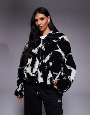 Nike Street - Giacca in pile borg nera e bianca con stampa | ASOS