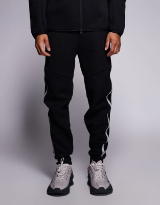 Nike Tech Fleece reflective sweatpants in black | ASOS