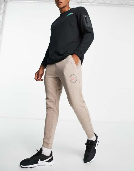 Nike Training - Jogger en polaire Dri-FIT - Gris | ASOS