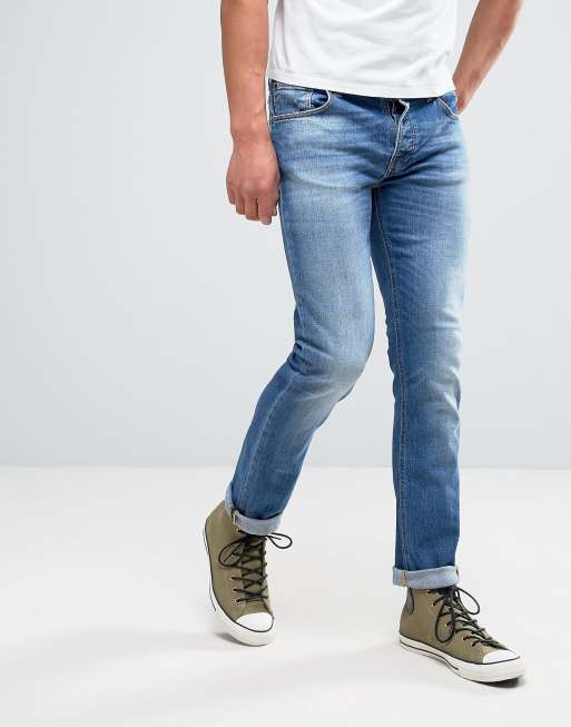 Nudie – Grim Tim – Orange Jeans mit Cloud Wash | ASOS