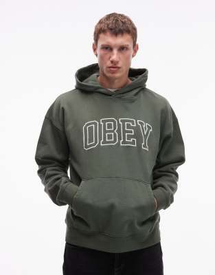 Obey – Kastiger College-Kapuzenpullover in verblasstem Khakigrün | ASOS