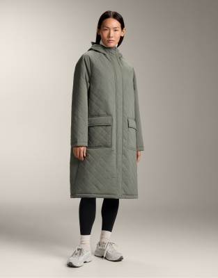 OYSHO - Giacca lunga imbottita impermeabile color kaki scuro con ...