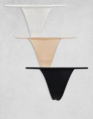 Pack de 3 tangas de hilo de color crema, blanco y negro con diseño ...