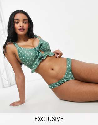 Peek & Beau fuller bust Exclusive high leg bikini bottom with frill detail in green floral | ASOS