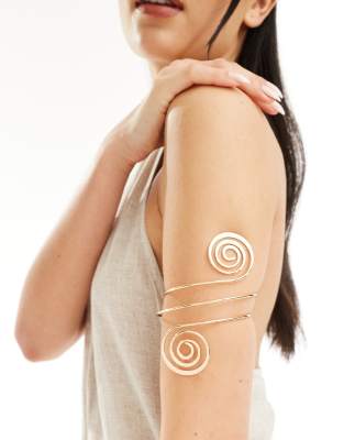 Petit Moments Ispica swirl arm cuff bracelet in gold | ASOS