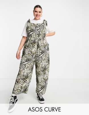 Peto con estampado animal, tirantes anudados y botones en la parte ...