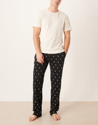 Polo Ralph Lauren all over icon logo lounge trousers in black | ASOS