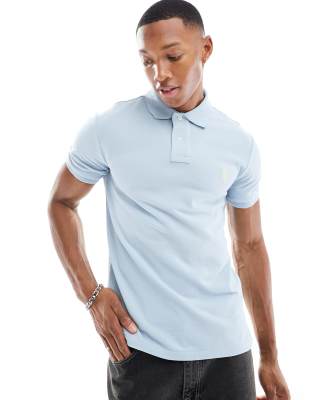Polo Ralph Lauren icon logo pique polo slim fit in light blue | ASOS