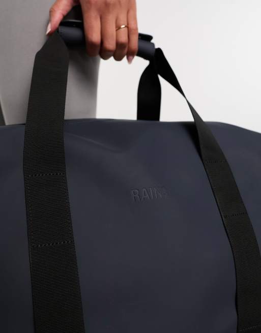 Rains 14200 unisex waterproof weekend duffle bag in navy | ASOS