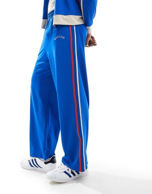 Reclaimed Vintage baggy sport track trackies with side stripe in blue ...