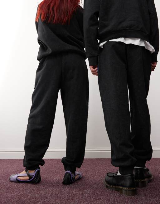 Reclaimed Vintage unisex trackies with flower print in washed black | ASOS