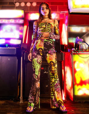 Reclaimed Vintage x Stranger Things mesh flare trousers in HellFire ...