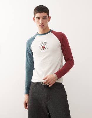 Reclaimed Vintage x Stranger Things Unisex ringer tee with Hellfire Club print in white | ASOS