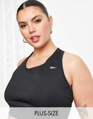 Reebok Training Plus small logo mid-support sports bra in black | ASOS