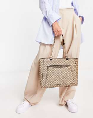 River Island monogram pocket front tote bag in brown | ASOS