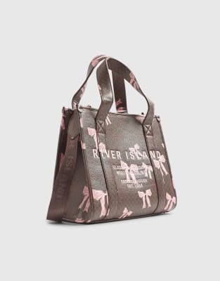 River Island Monogram print bow tote bag in brown - dark | ASOS